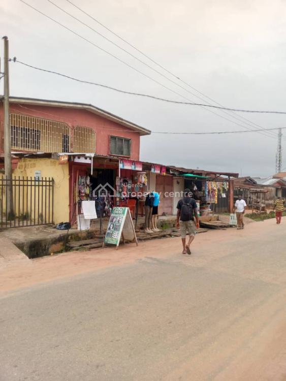 For Sale: 50ft By 100ft Land With A Structure And 4 Stores At The Front, Along Uwa Tarred Road ...